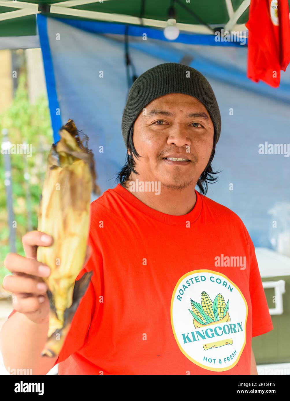 Toronto, Canada, an immigrant man sells roast corn in the Cabbage Town ...