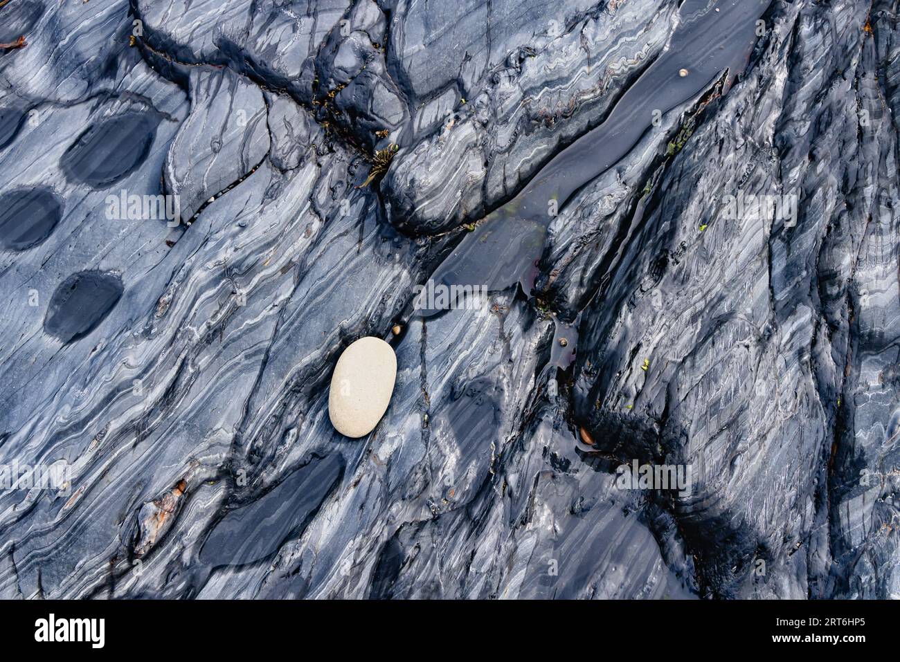 picture of rock structures with water channels and stones on a rocky ...