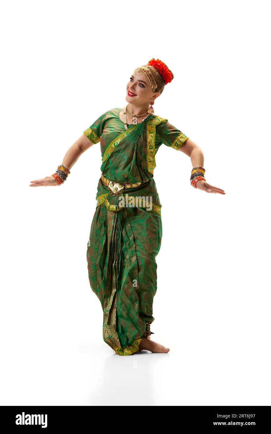 Artistic beautiful performance. Woman in indian dress dancing ...