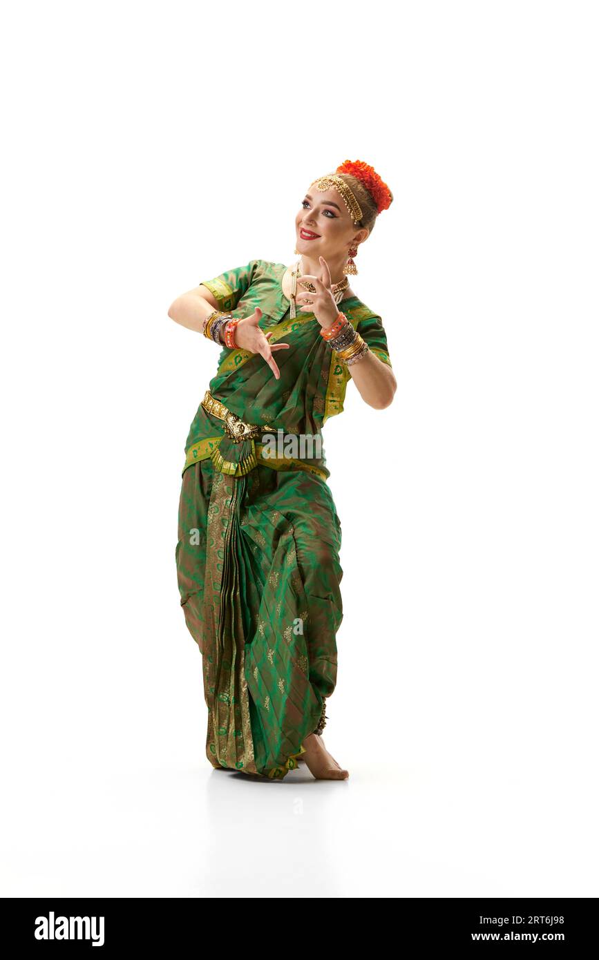 Artistic beautiful performance. Woman in indian dress dancing ...