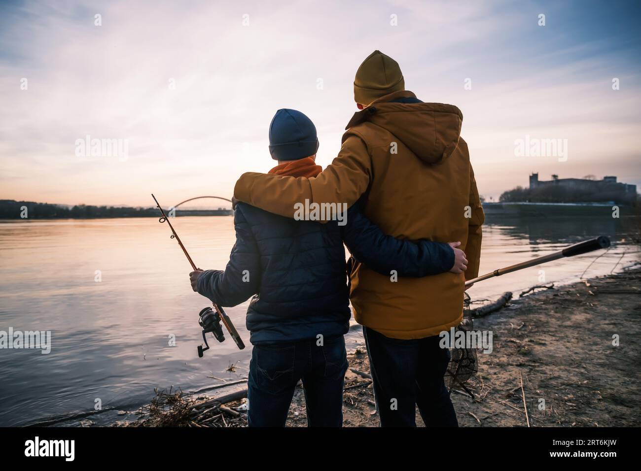 Two teenager adult fishing hi-res stock photography and images - Alamy