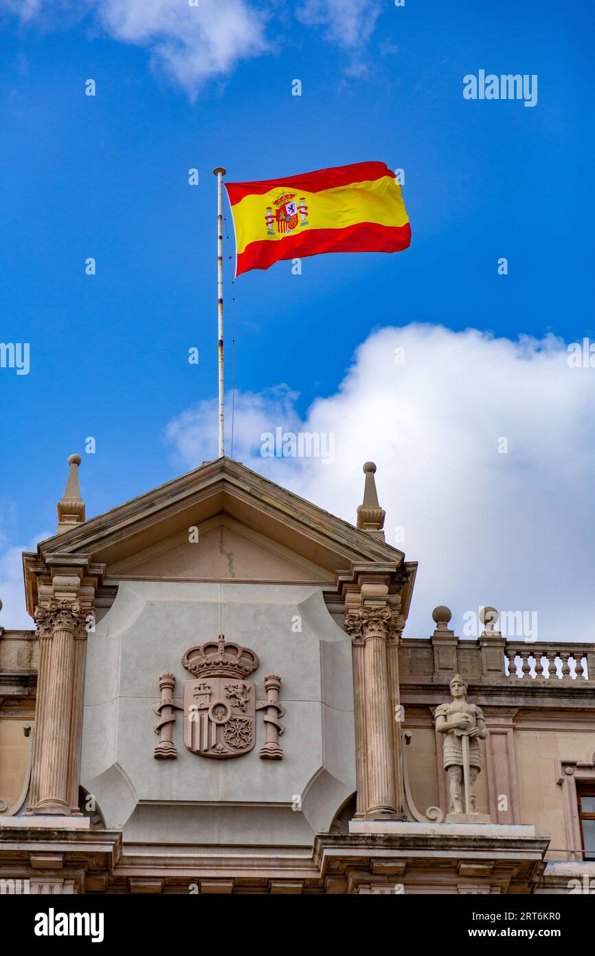 Spanish flag waving in the clear blue sky Stock Photo - Alamy