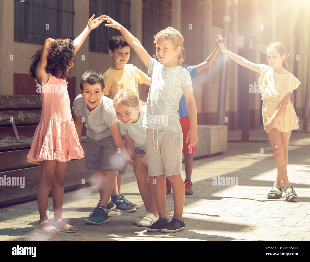 Group of happy kids playing a game called trickle on the street Stock ...