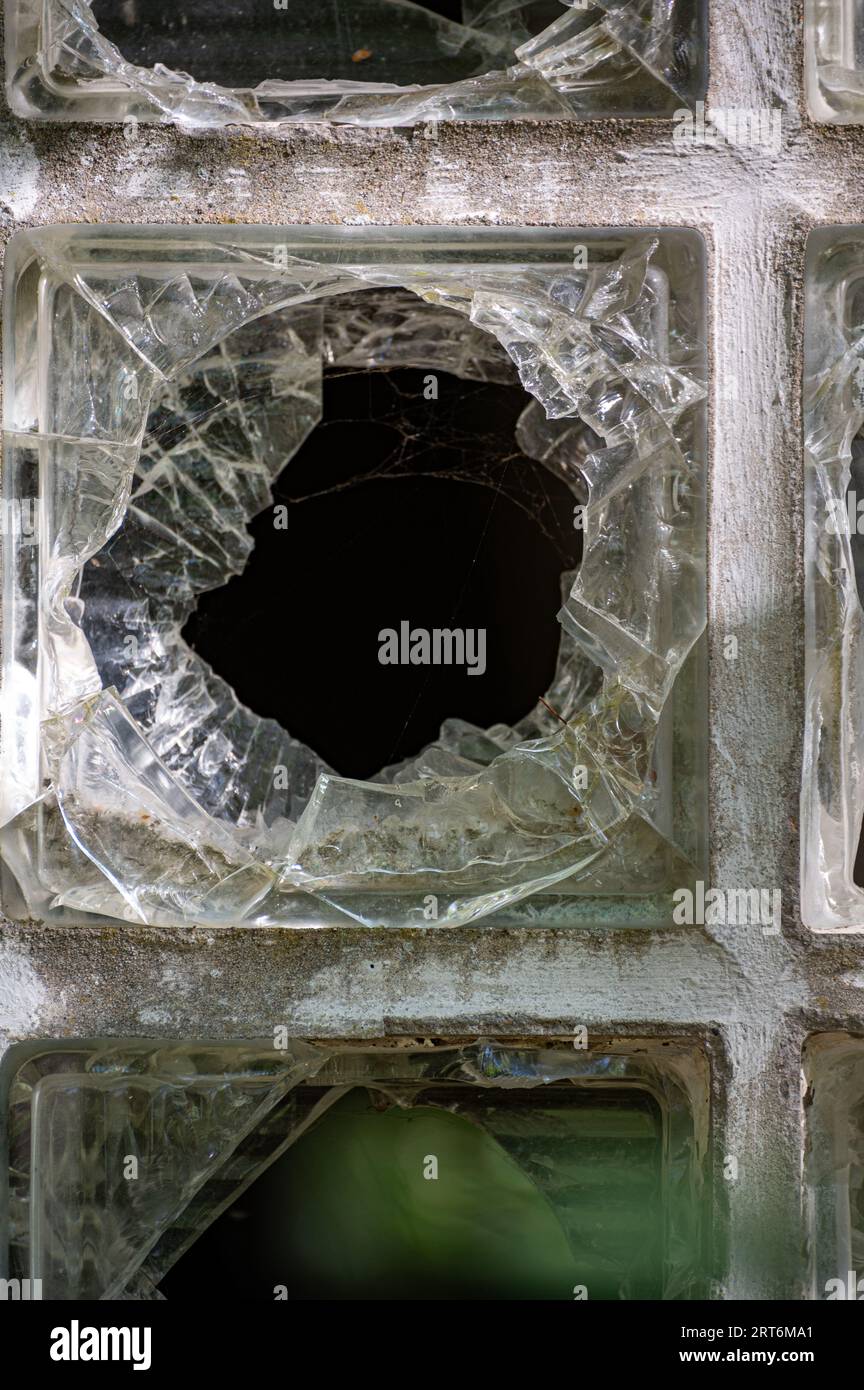 Window broken into pieces making a hole Stock Photo - Alamy