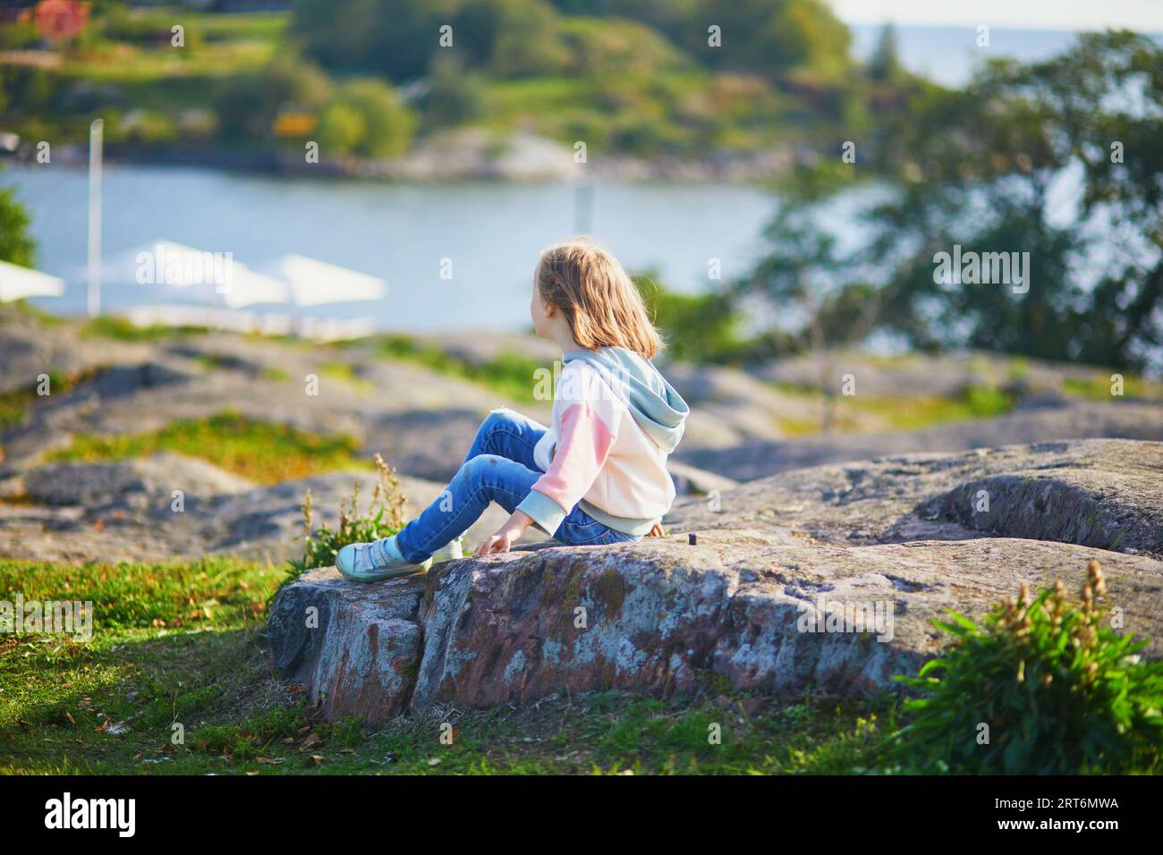 Adorable preschooler girl in Kaivopuisto park in Helsinki, Finland ...