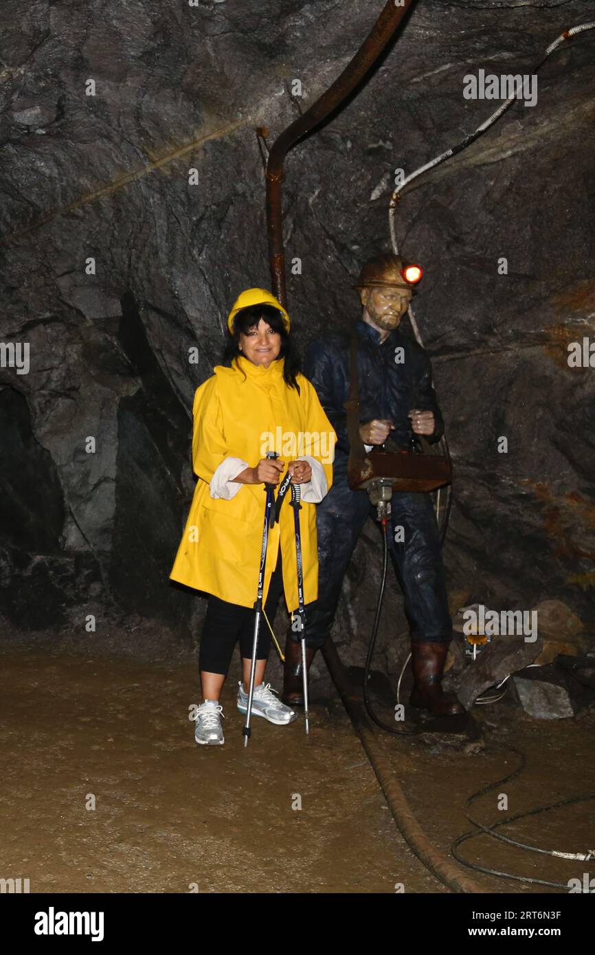 old woman walks inside a cave Stock Photo - Alamy