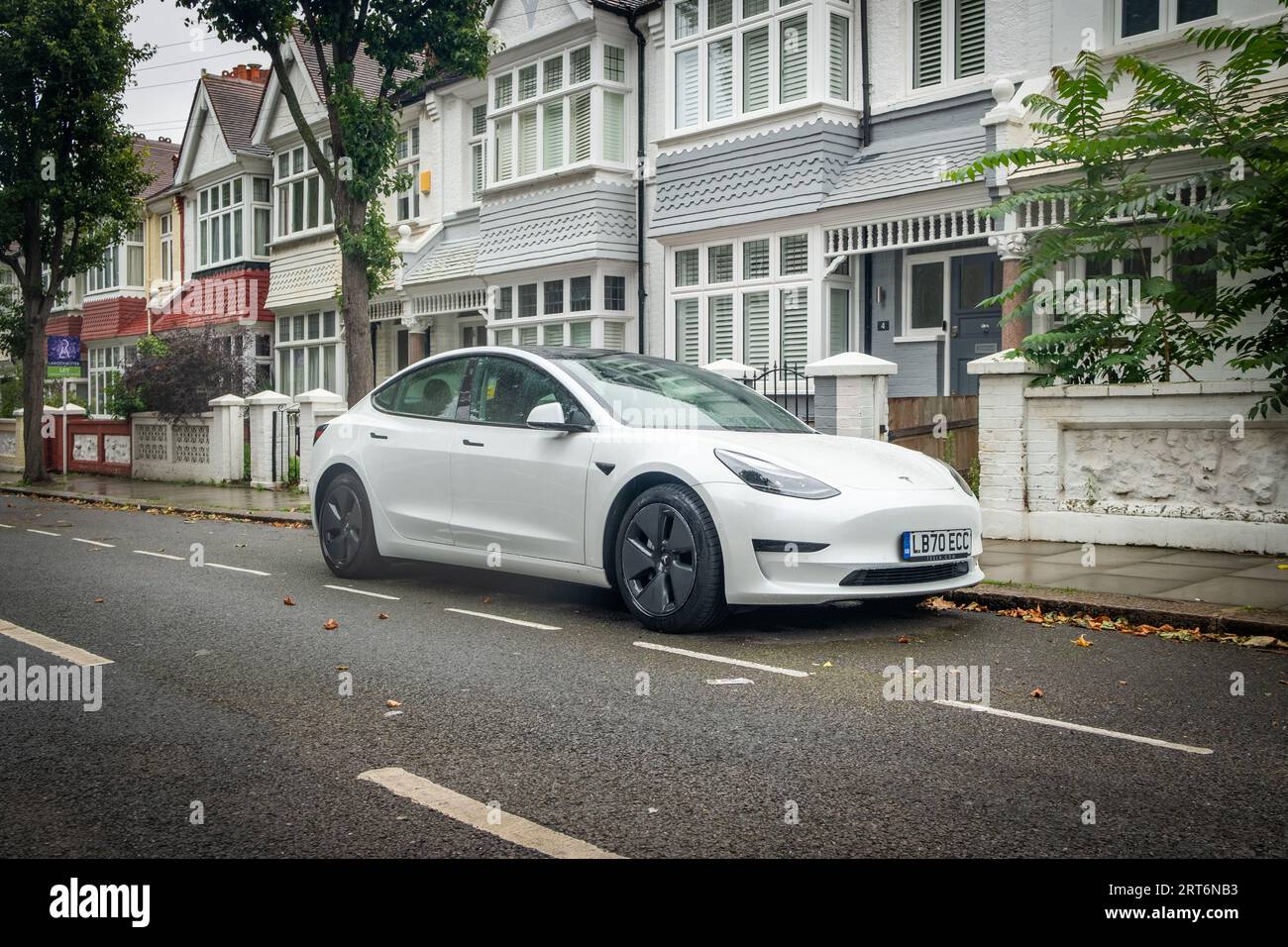 LONDON- AUGUST 8, 2023: Tesla Model 3 parked on London residential ...