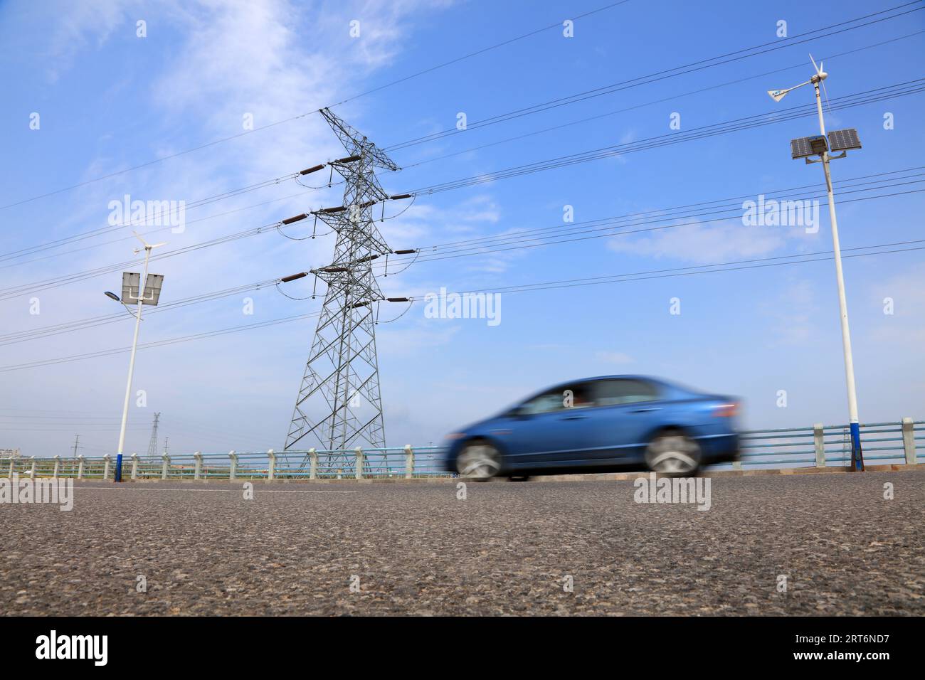Electric towers and moving vehicles Stock Photo - Alamy