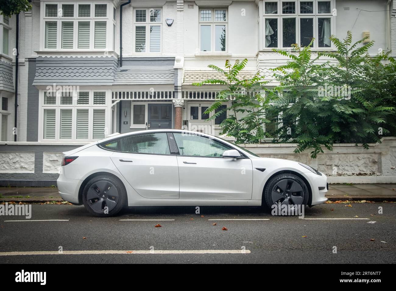 LONDON- AUGUST 8, 2023: Tesla Model 3 parked on London residential ...