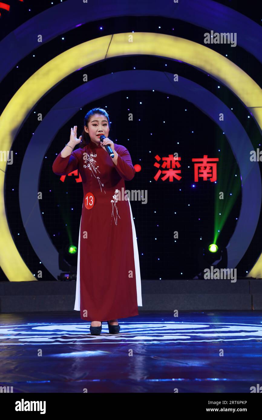 Chinese girl singing on stage hi-res stock photography and images - Alamy