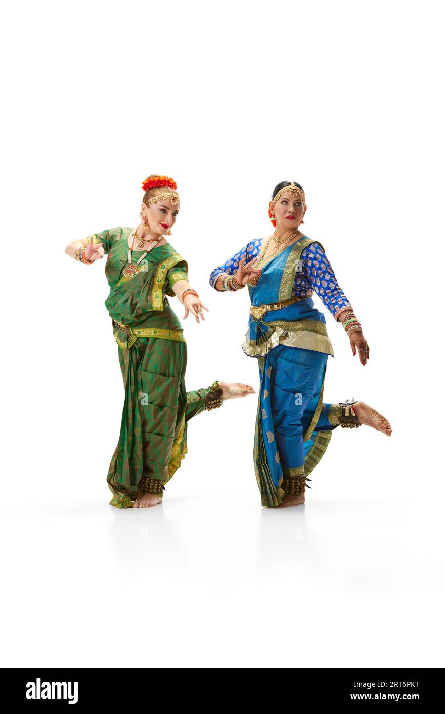 Sattriya dance. Women, in beautiful traditional indian dresses dancing ...
