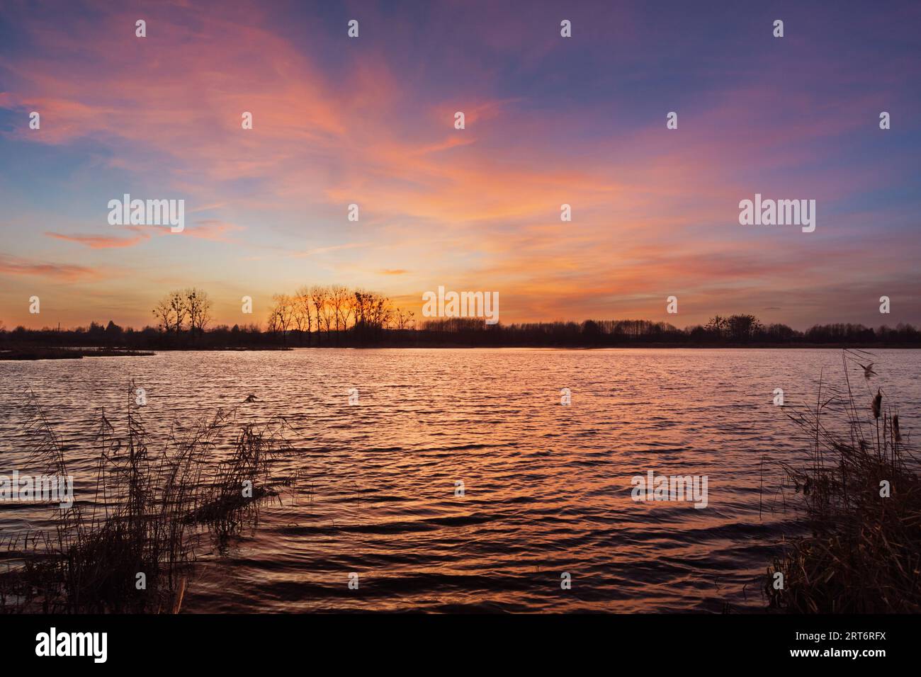 Scenic sunset over lake colorful hi-res stock photography and images ...