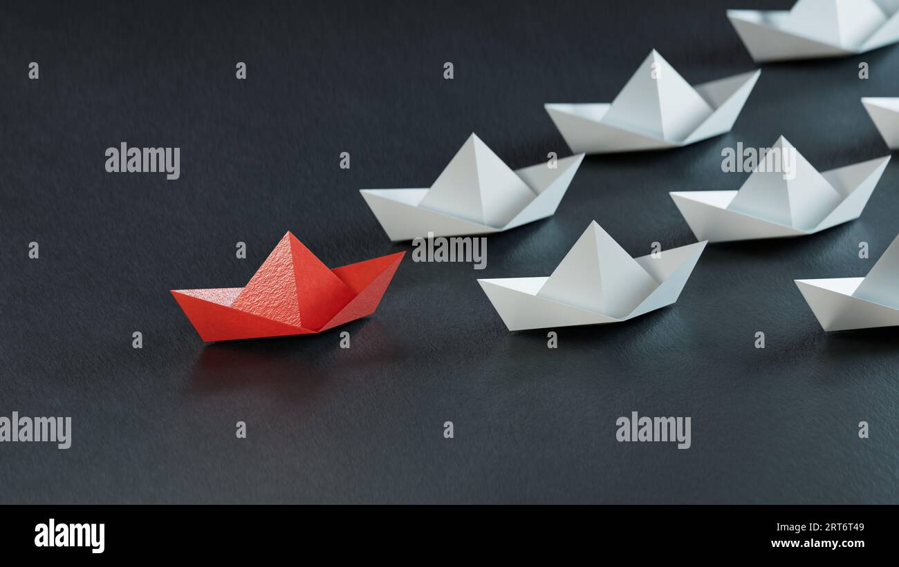 Leadership concept. Red leader paper ship leading among white on black ...