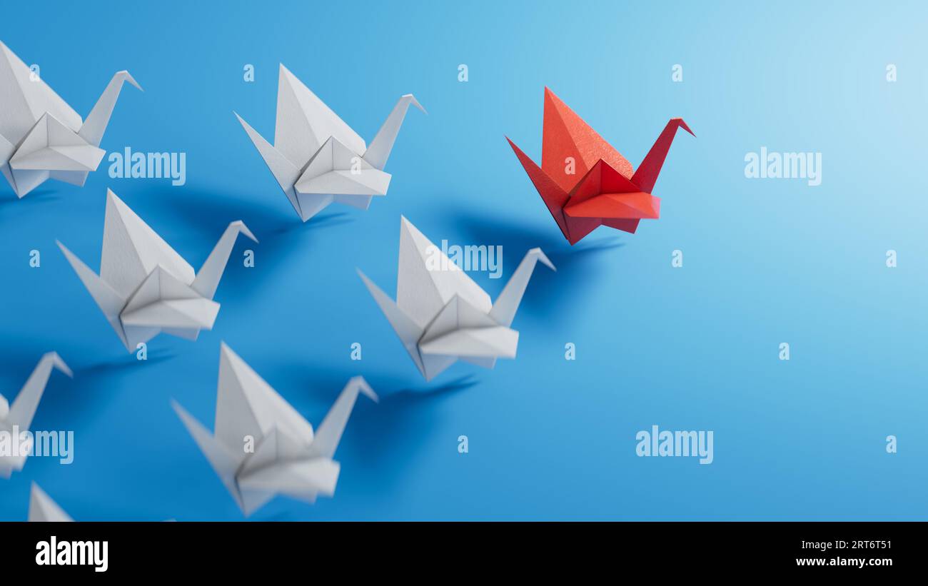 Boss vs Leader concept. White origami birds behind red one on blue ...