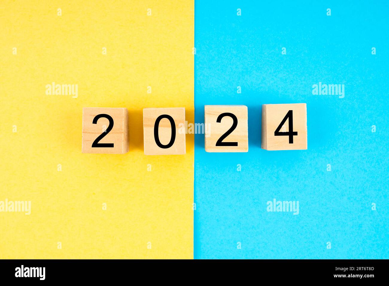 Number 2024 on wooden cube blocks with yellow and blue background Stock ...