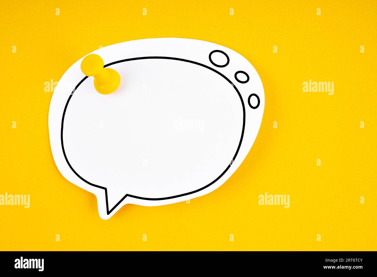 Blank speech bubble and push pin on yellow background Stock Photo - Alamy