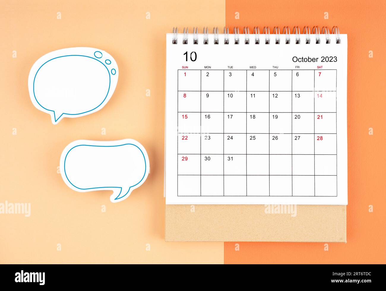 October 2023 desk calendar and empty speech bubble on beautiful ...
