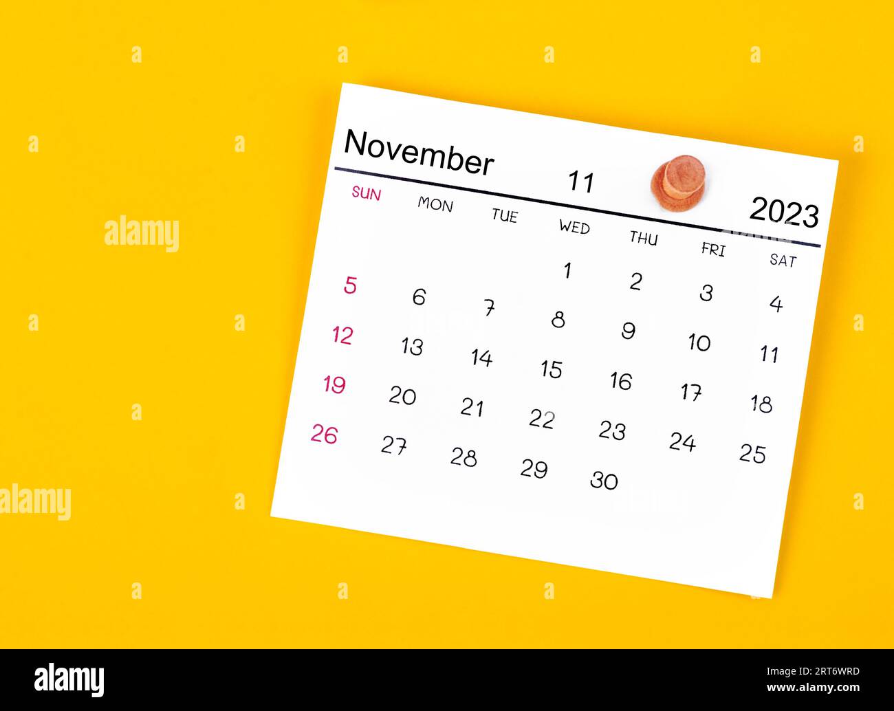November 2023 and wooden push pin on yellow background Stock Photo - Alamy