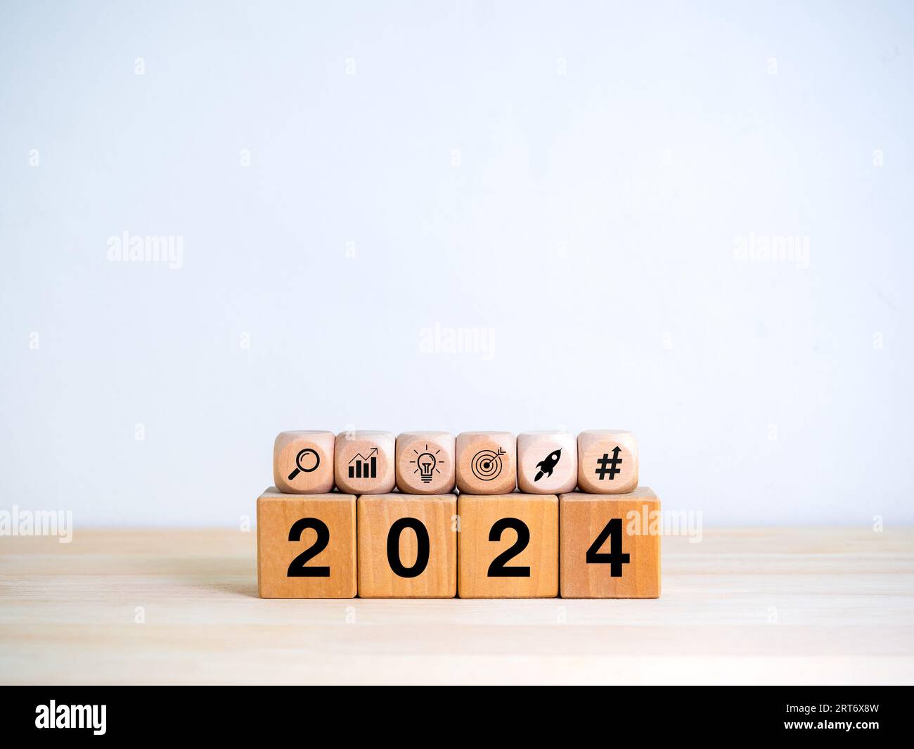 2024 trends concept. Trend icons and 2024 year number on wooden cube ...