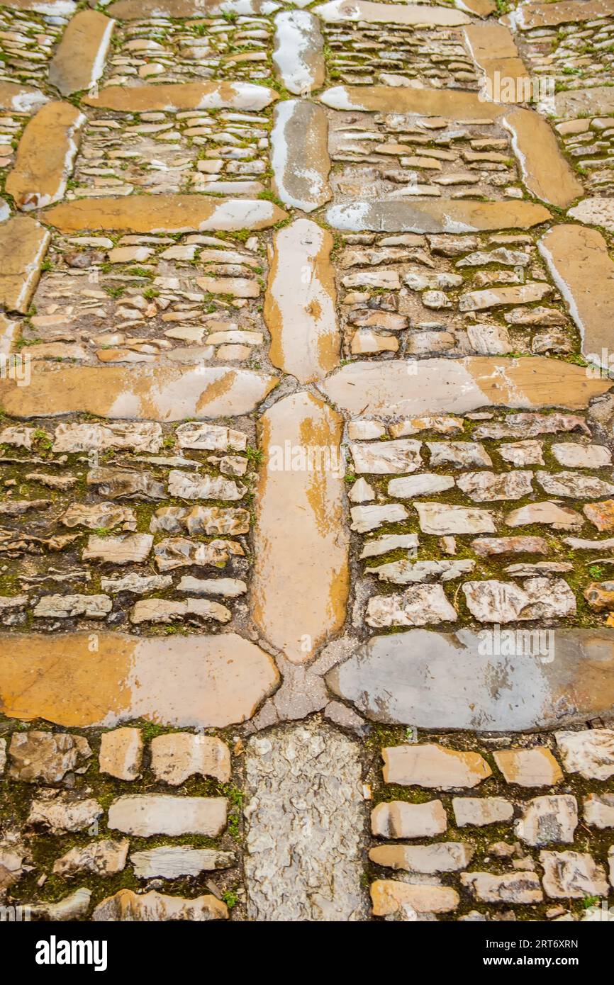 Background with wet medieval style pavement Stock Photo - Alamy