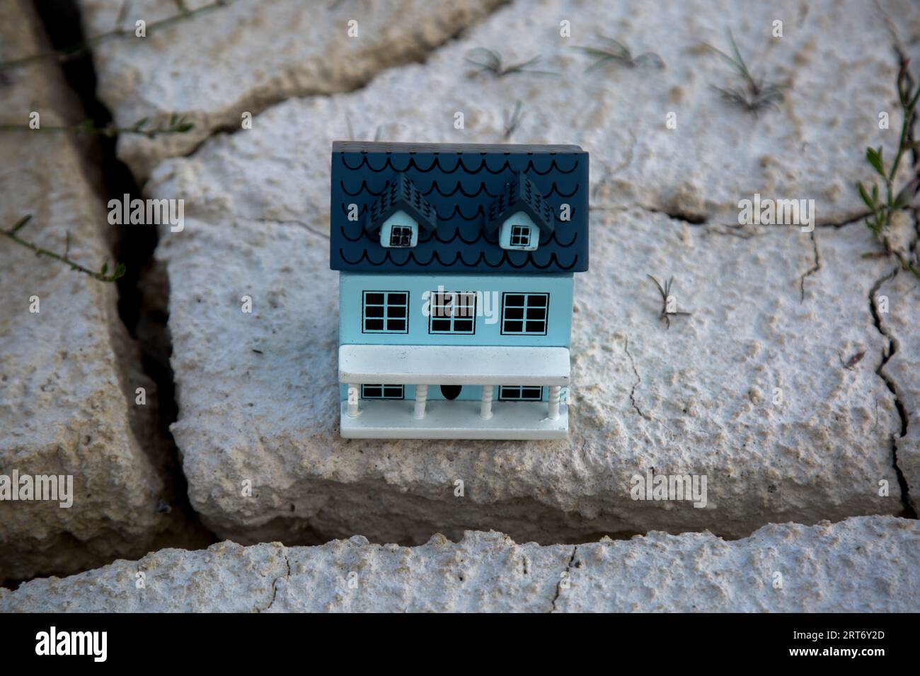 A small house edge of a precipice, the concept of an earthquake and ...