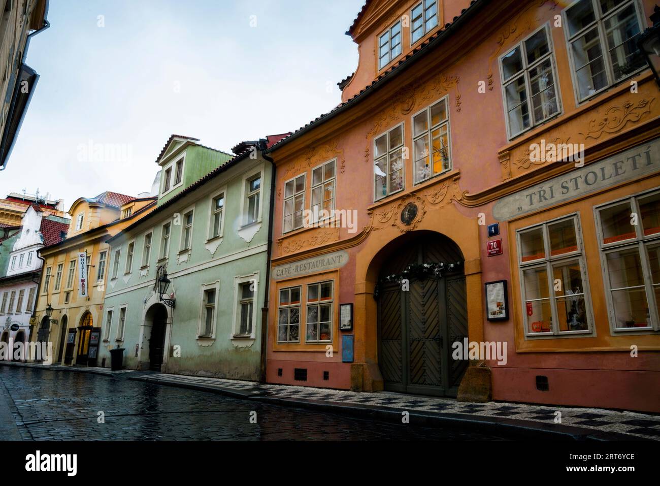Baroque Tri Stoleti and cobblestone street in medieval Prague, Czech ...