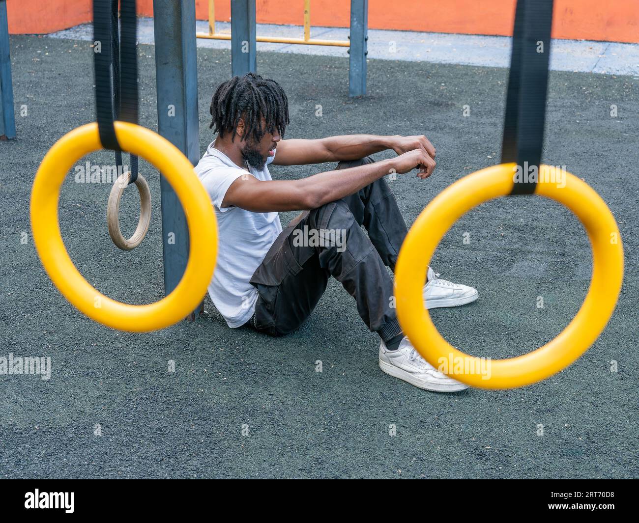 Full body side view of young African American man with dreadlocks ...