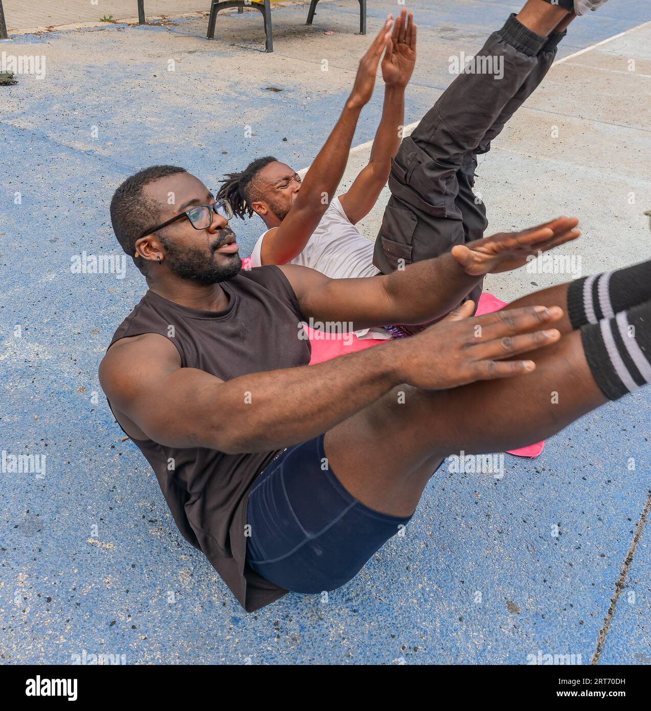 High angle of African American male athletes doing exercise on sports ...