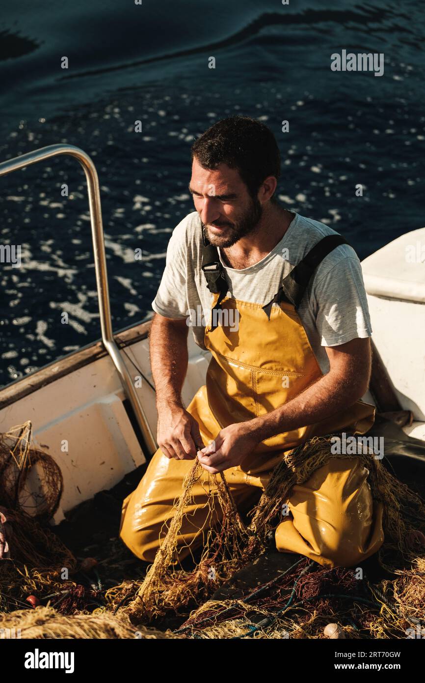 Trawler net repair hi-res stock photography and images - Alamy