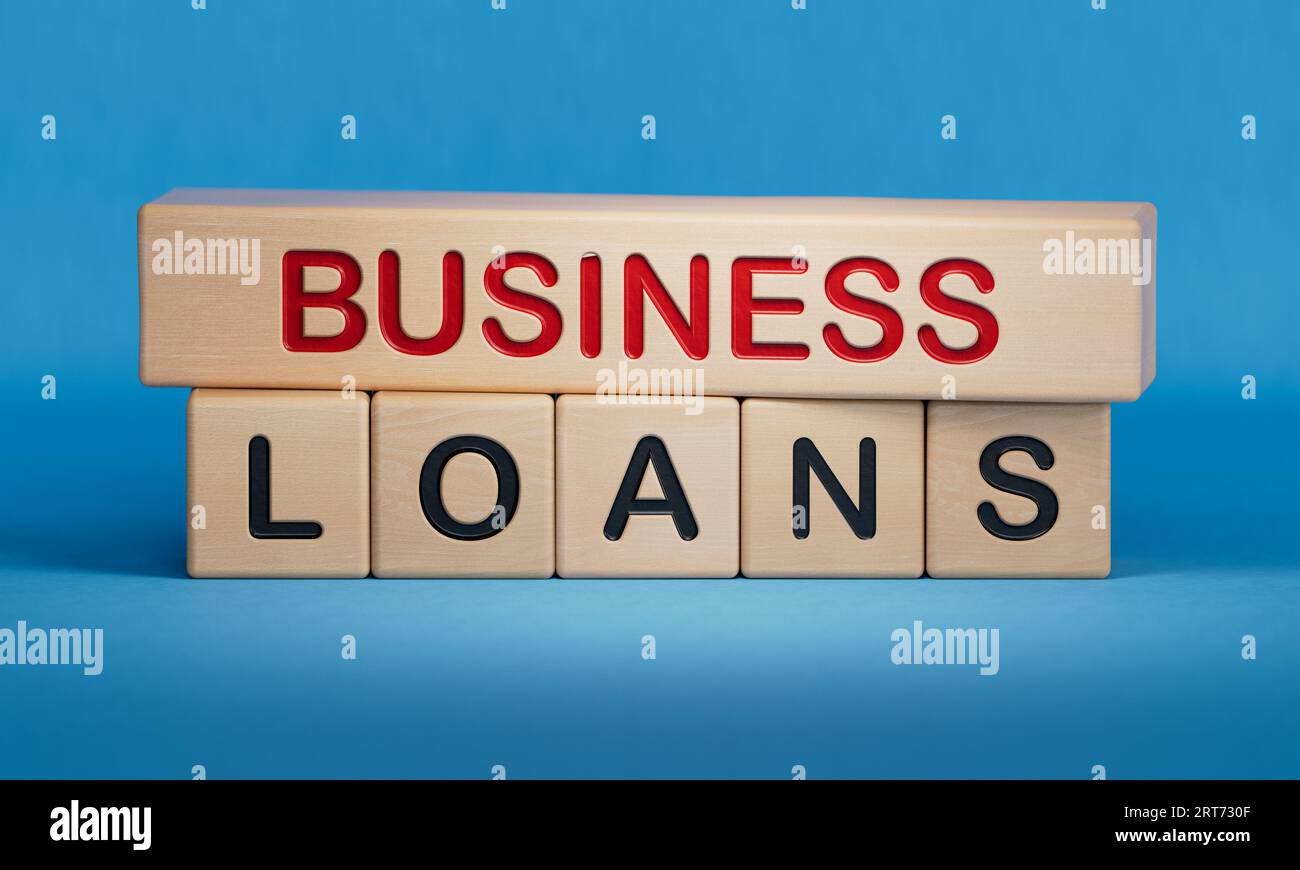 Time to business loan. Concept words 'business loan' on wooden blocks ...