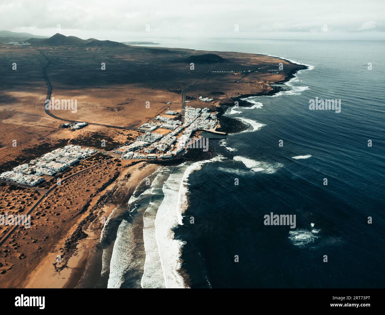 Aerial photo of sunset on Caleta de Famara in Canary Islands ...