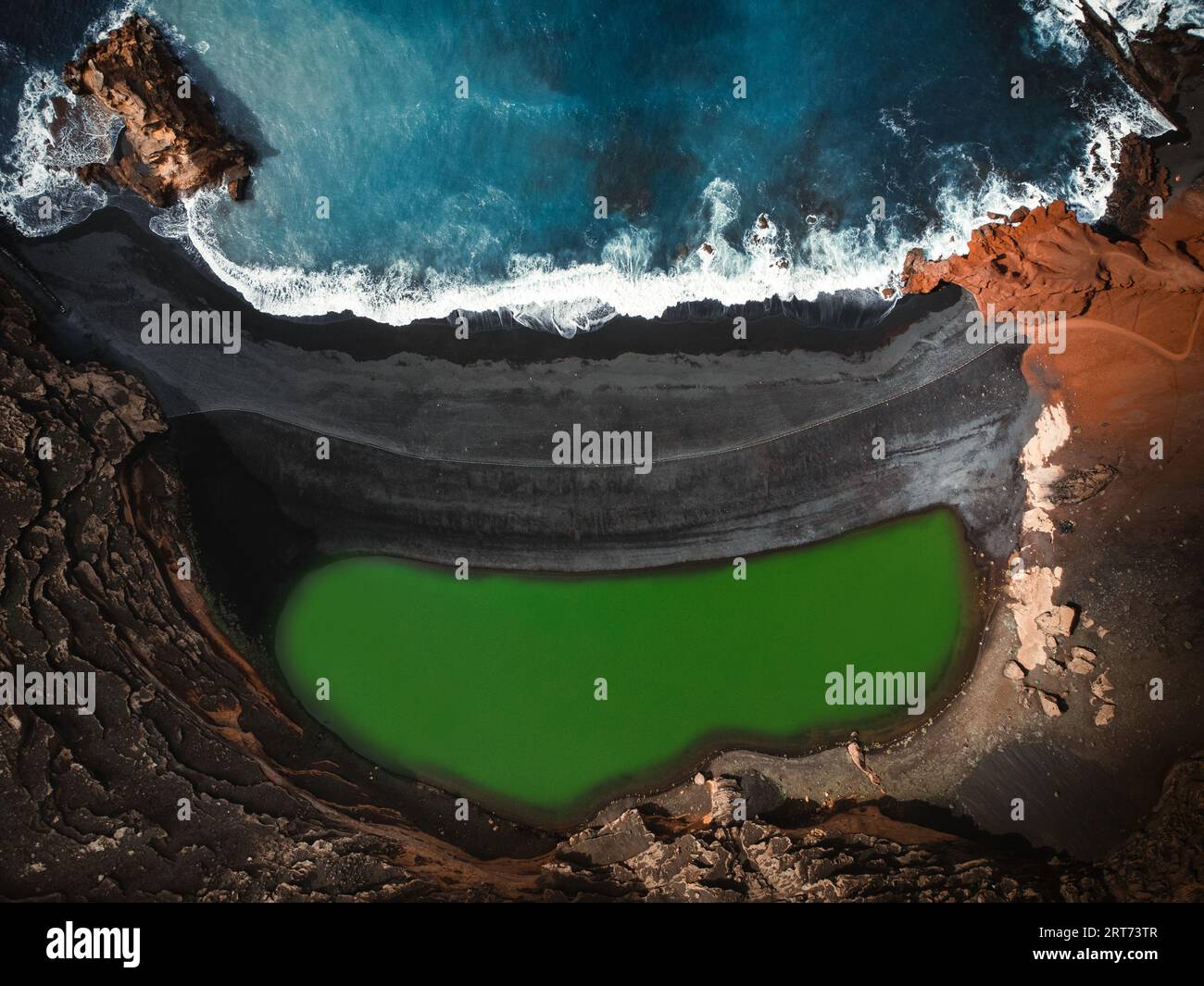 Aerial view of the El lago Verde (Lanzarote) - green lagoon with blue ...