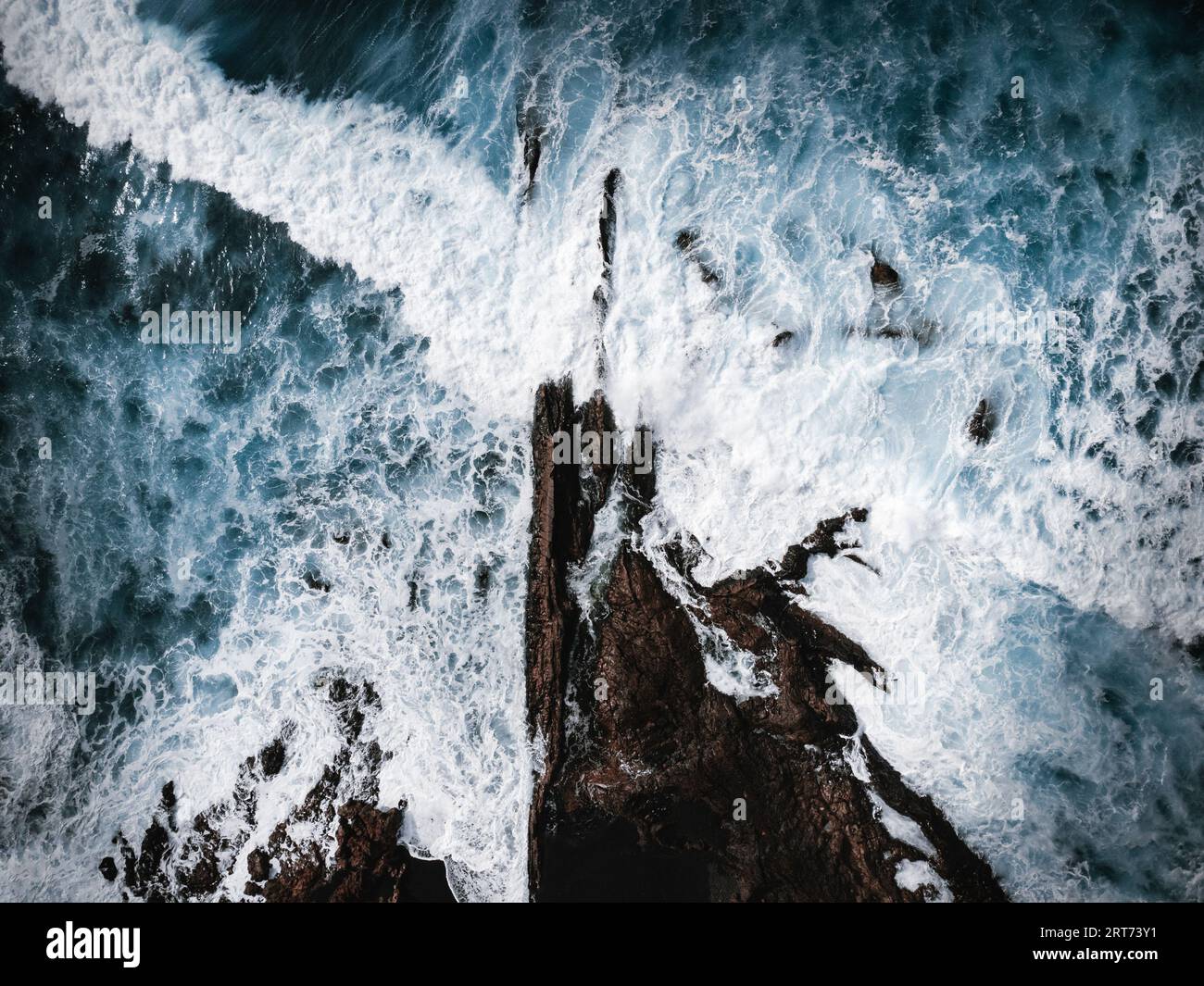 Aerial photo of strong and powerful ocean with huge waves. Rocks and ...