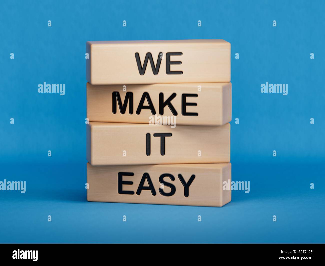 We make it easy symbol. Concept words We make it easy on wooden cubes ...