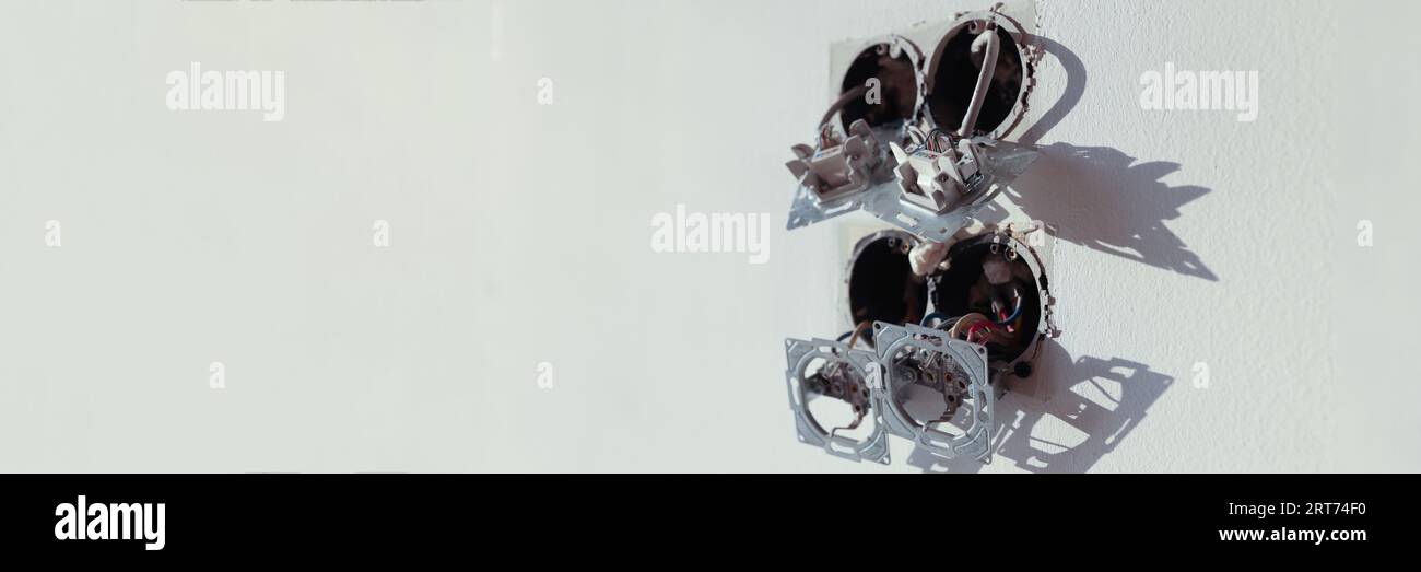 Changing wall electric socket and installing new AC power line Stock ...