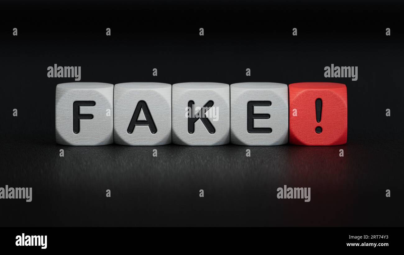 Concept for fake news. Cubes placed on a newspaper form the word "FAKE ...