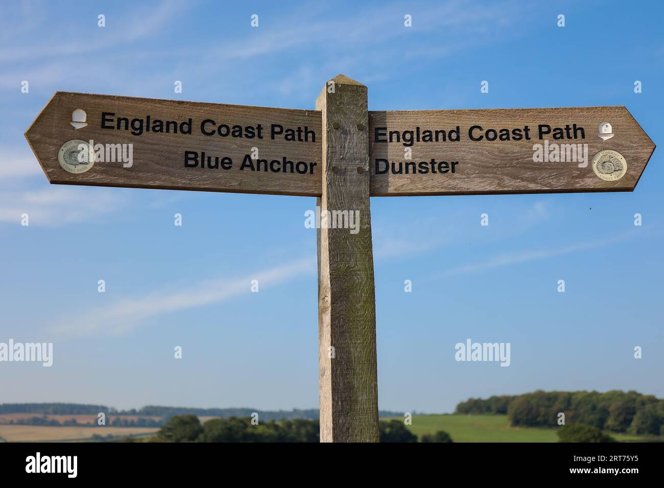 A wooden sign showing the direction. England Coast Path Blue Anchor and ...