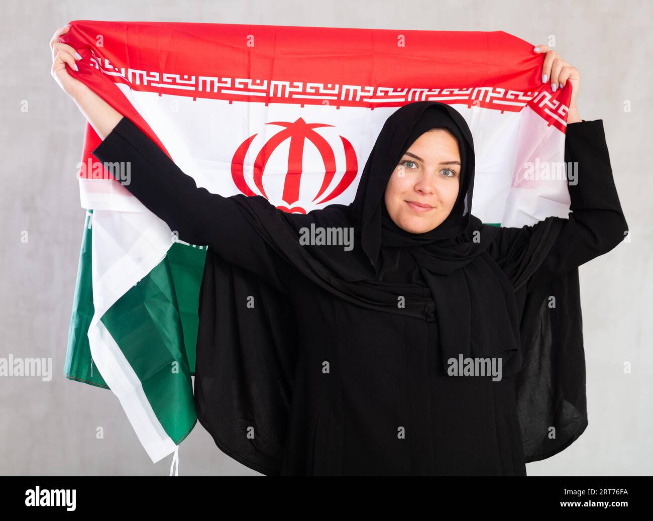 Happy young woman dressed in traditional islamic clothes with iranian ...