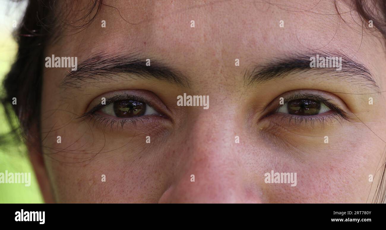 Casual woman looking to camera, close-up eyes opening and closing Stock ...