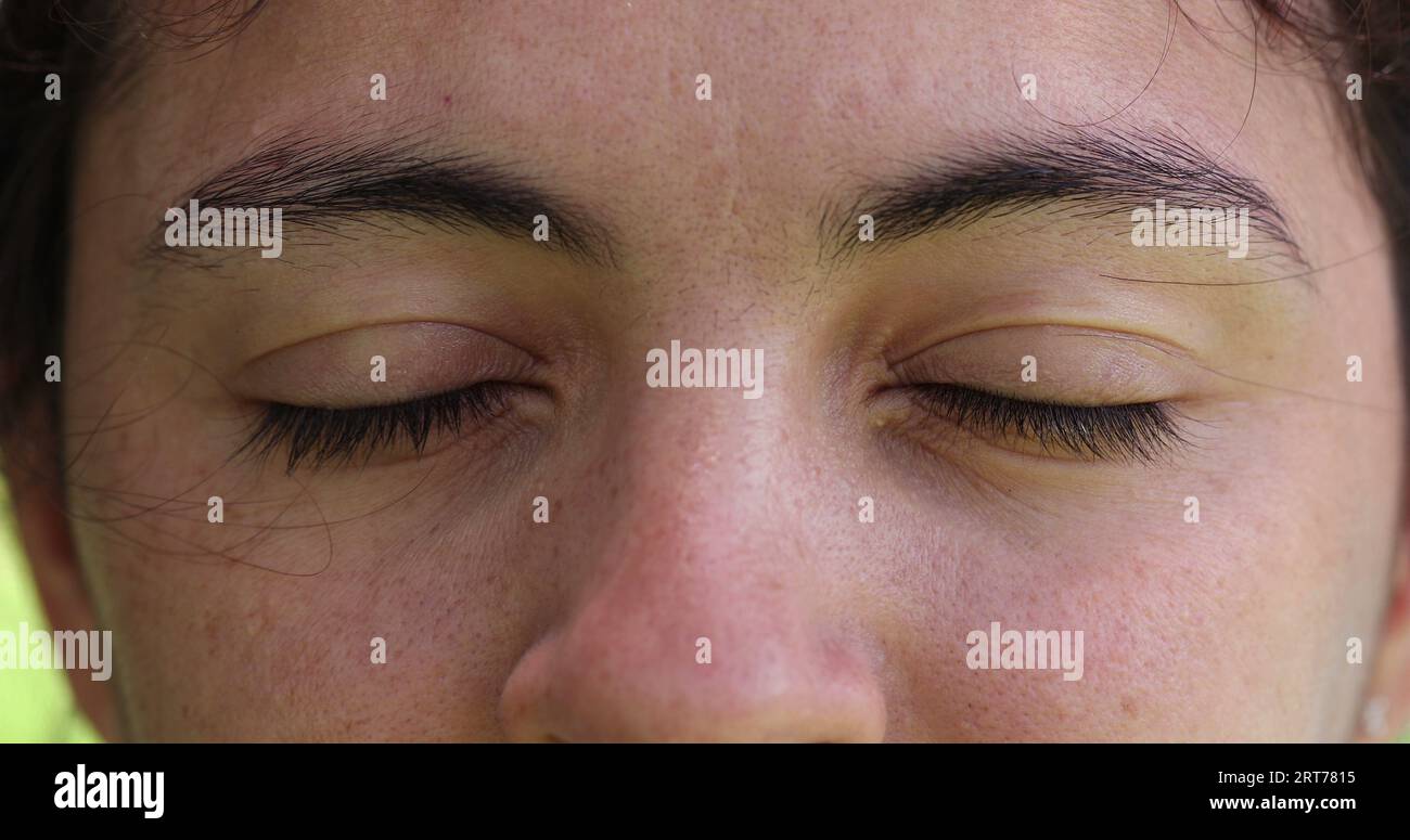 Casual woman looking to camera, close-up eyes opening and closing Stock ...