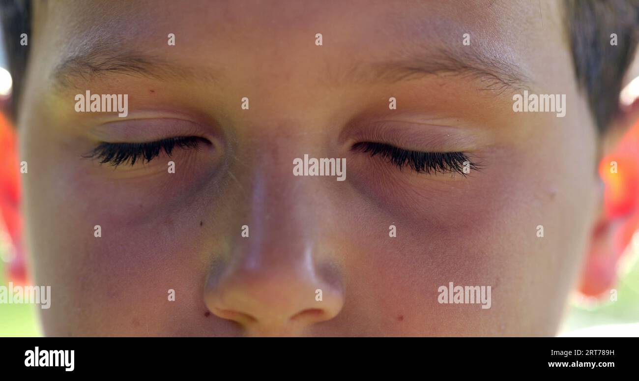 Boy face closing eyes close-up. Child macro eyes with eyes closed in ...