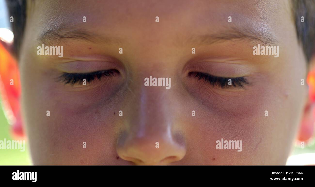 Boy face closing eyes close-up. Child macro eyes with eyes closed in ...