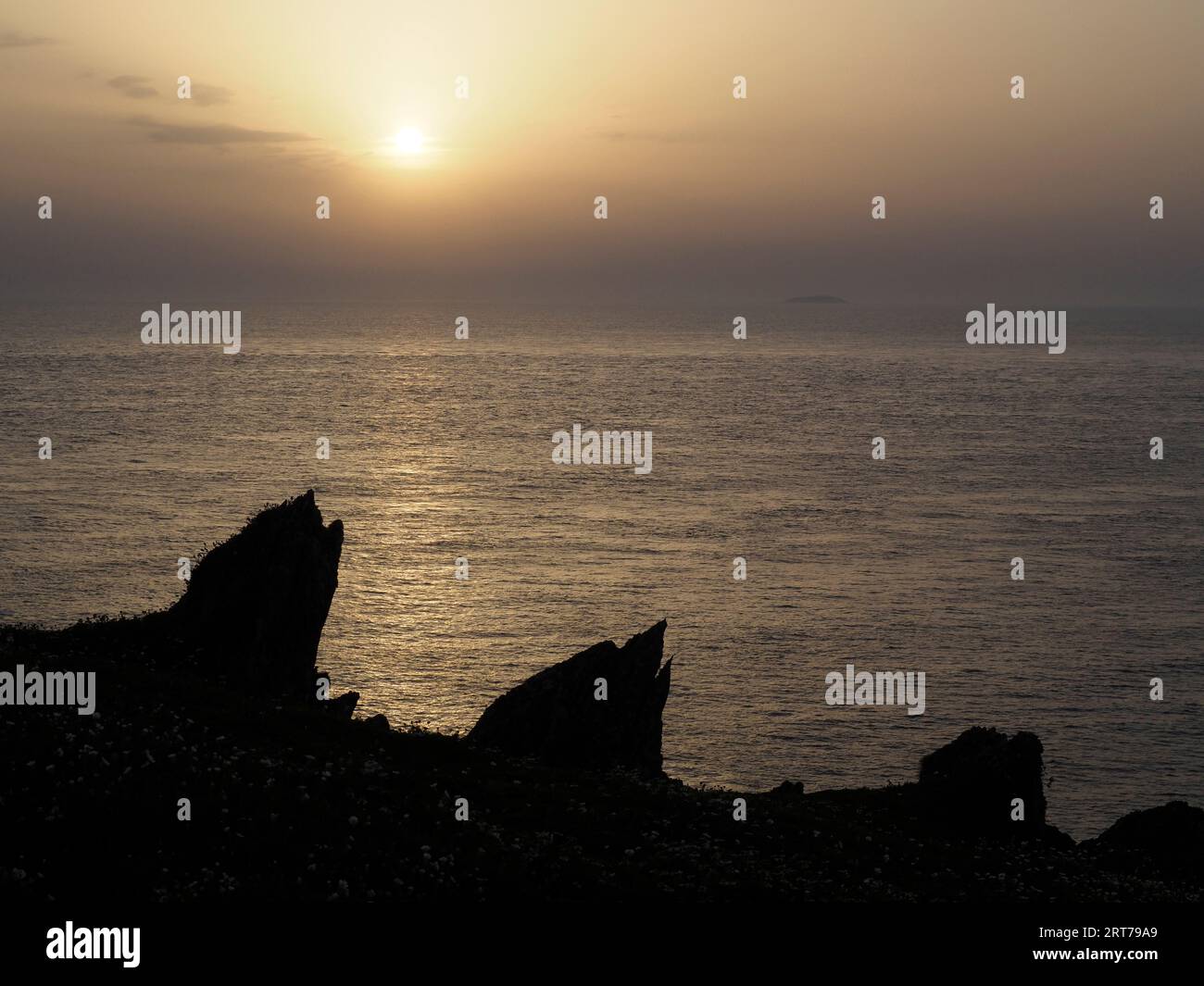 Sunset over Grassholm from Skokholm, Pembrokeshire, Wales Stock Photo ...