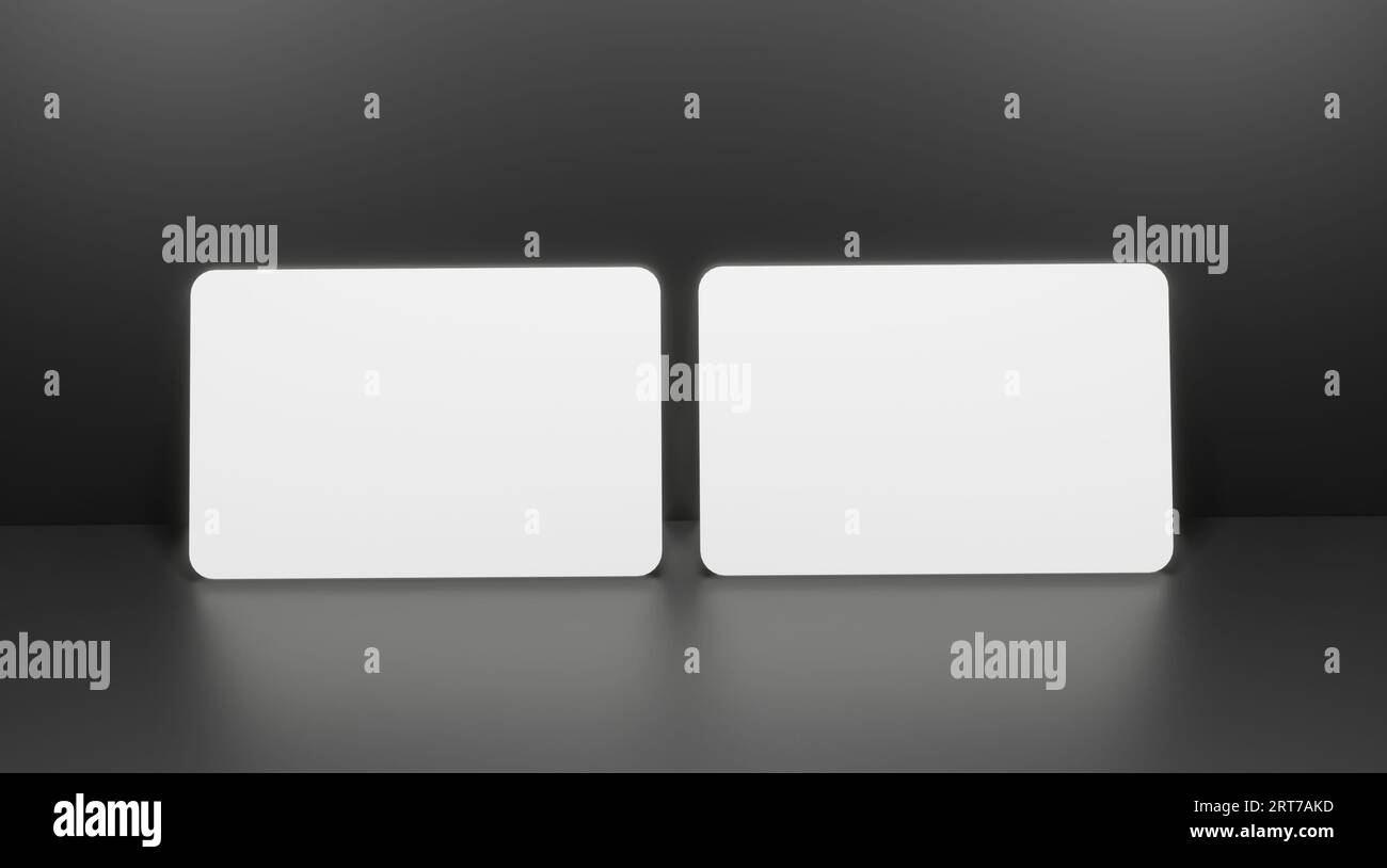 Two white template for business card on a black studio background ...