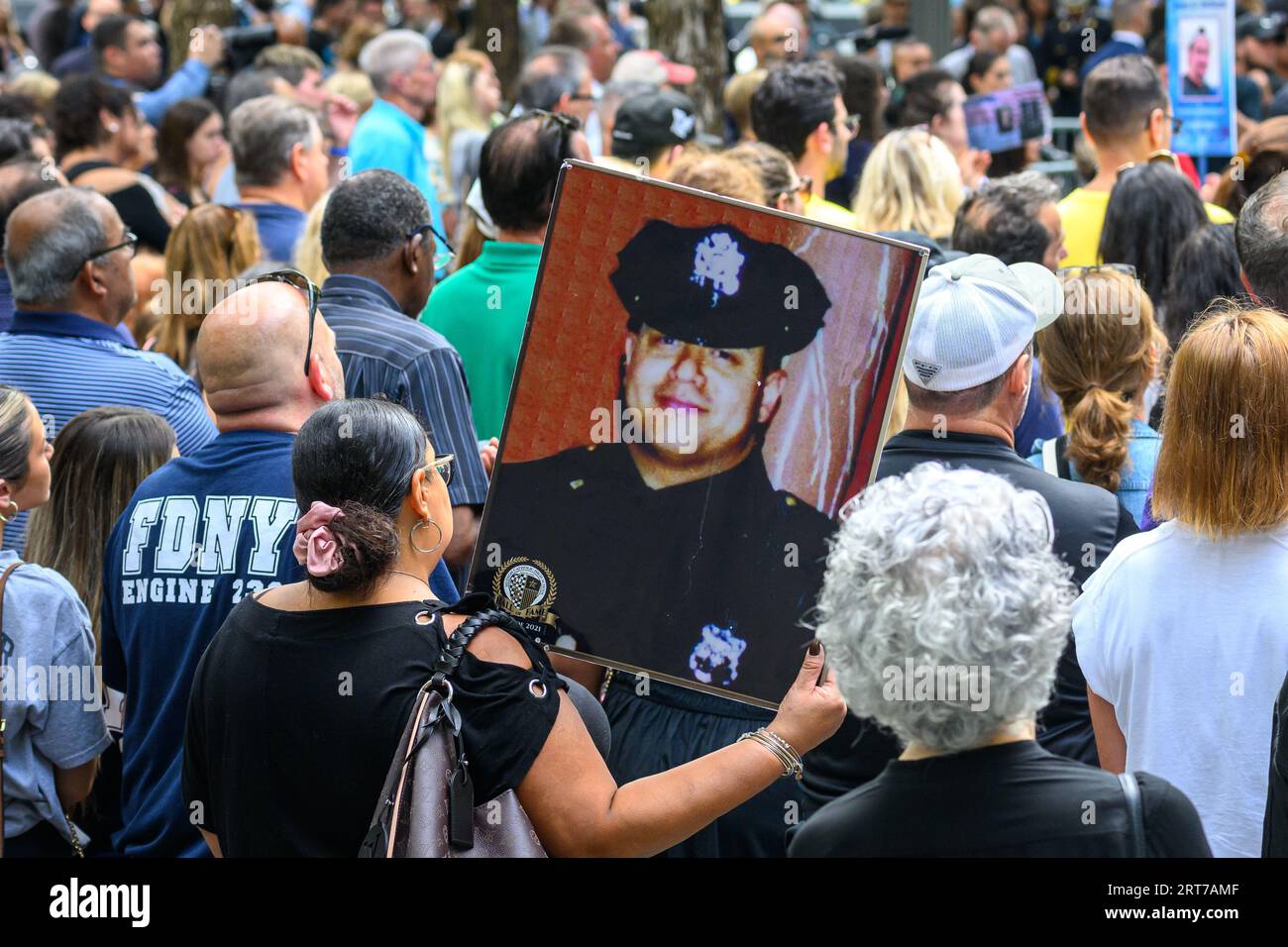 New York, USA. 11th Sep, 2023. Attendees honor their relatives who died ...