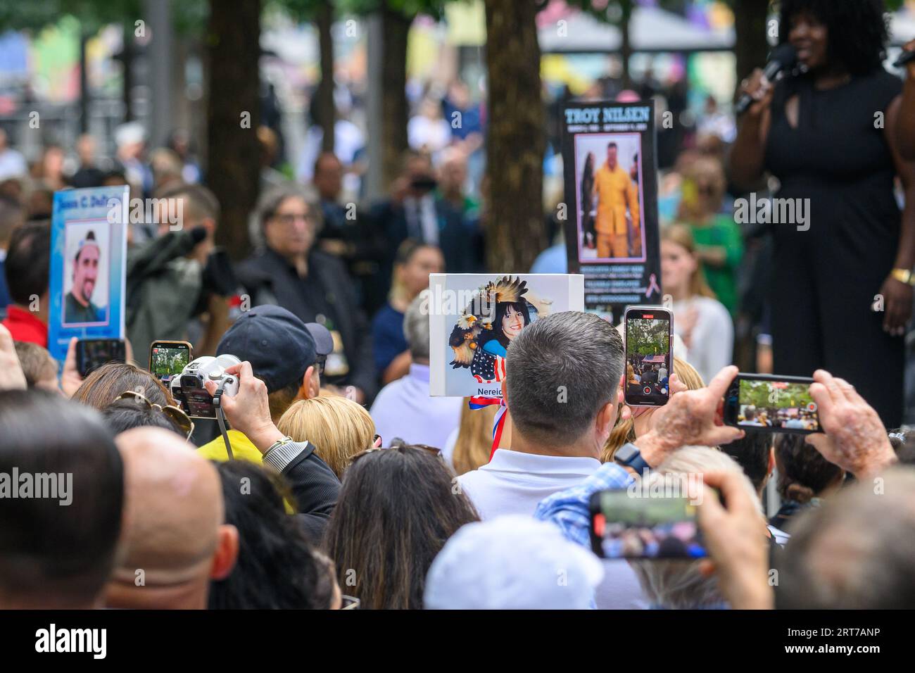 New York, USA. 11th Sep, 2023. Attendees honor their relatives who died ...