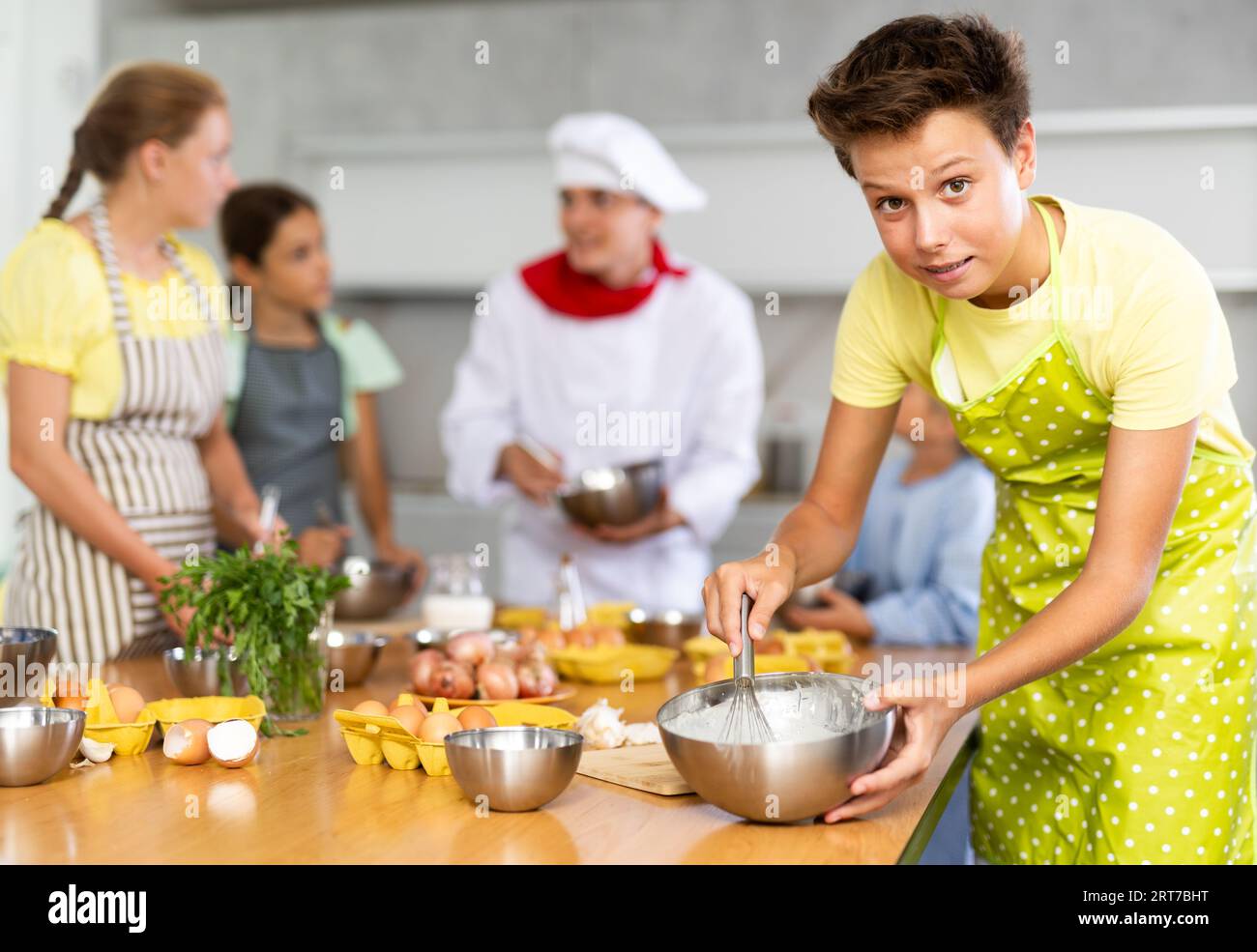 Boy carefully cooking hi-res stock photography and images - Alamy