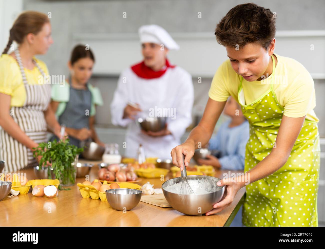 Boy carefully cooking hi-res stock photography and images - Alamy