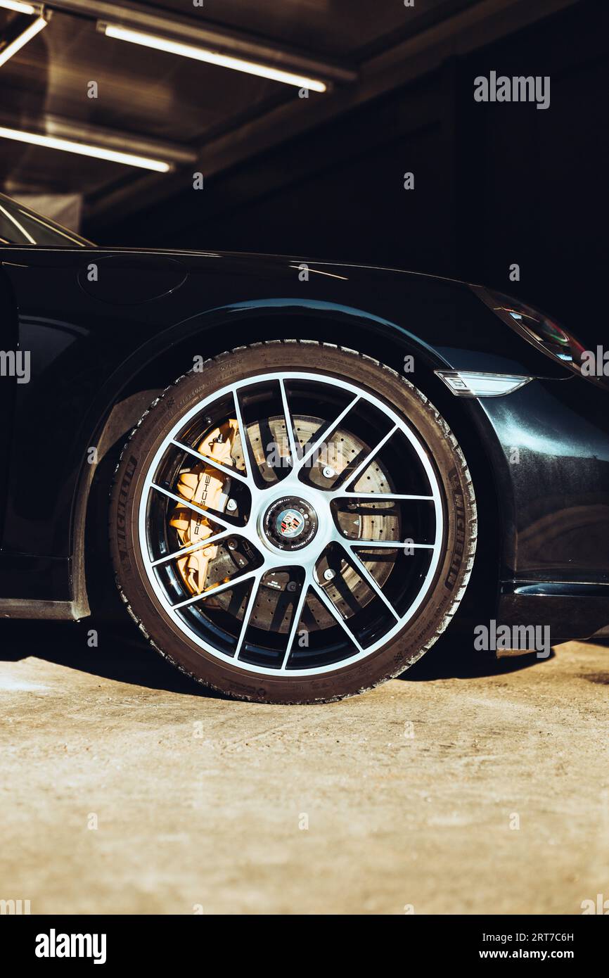 A high-performance black Porsche sports car with a sleek exterior ...