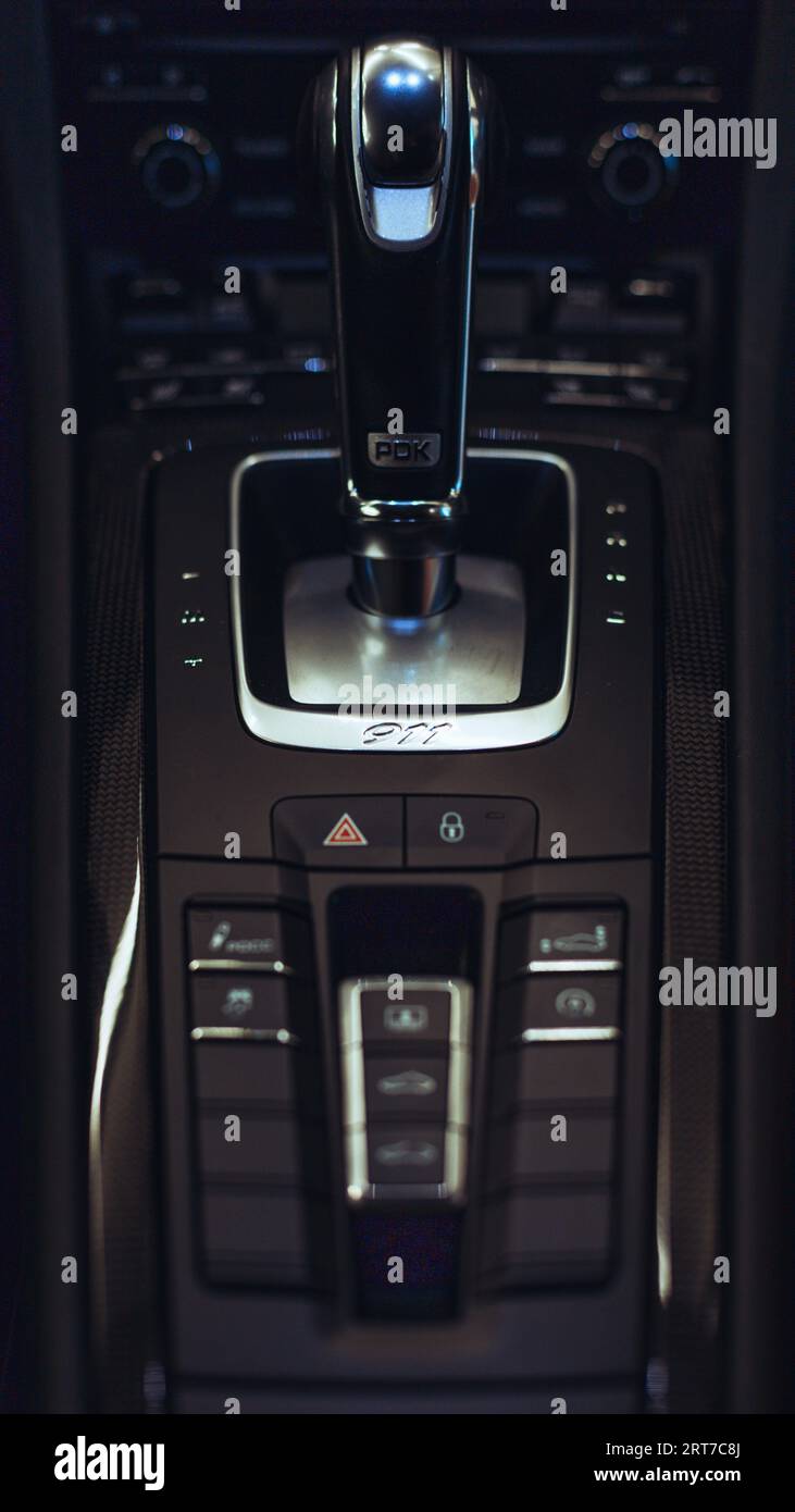 An interior view of a vehicle dashboard showing the manual shift gear ...